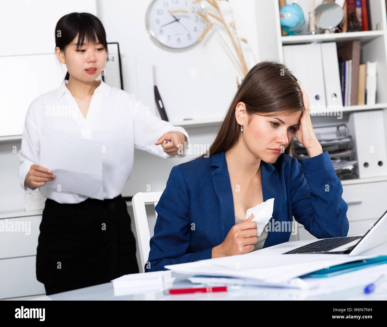 Angry boss screaming to young female manager during working Stock Photo ...