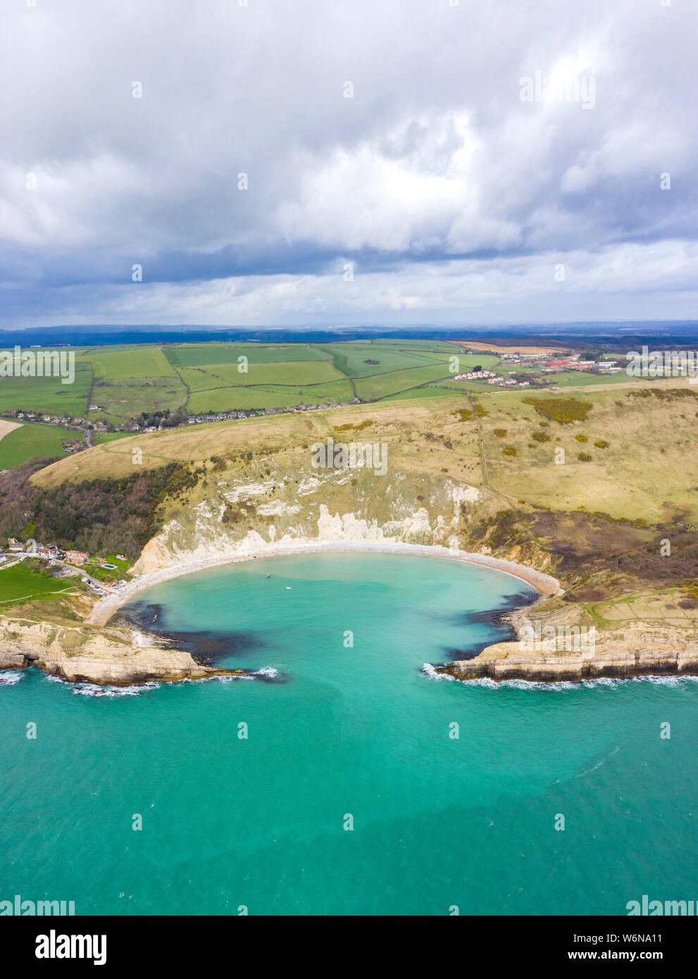 Aerial view of Lulworth Cove with Cathedral Cavern and Stair Hole, West ...