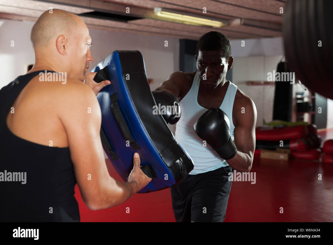 Men practicing effective techniques of self-defence during individual ...