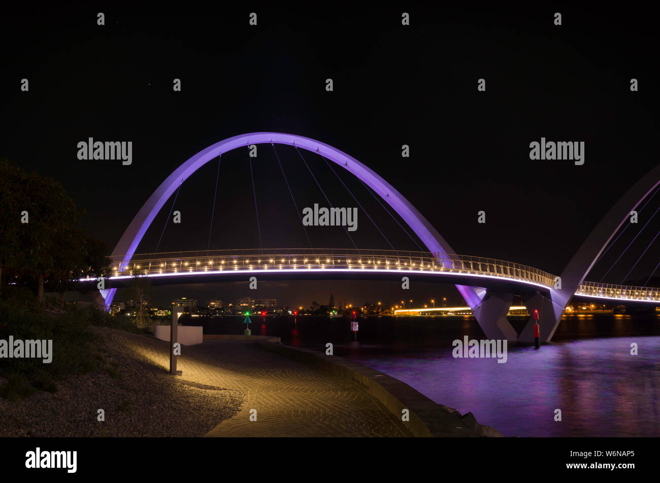 The Elizabeth Quay walking bridge lit up in blue at night in Perth ...