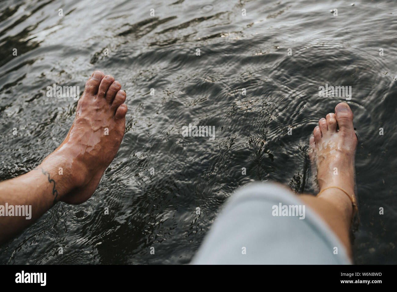 tattooed human foot in the water of a river Stock Photo - Alamy