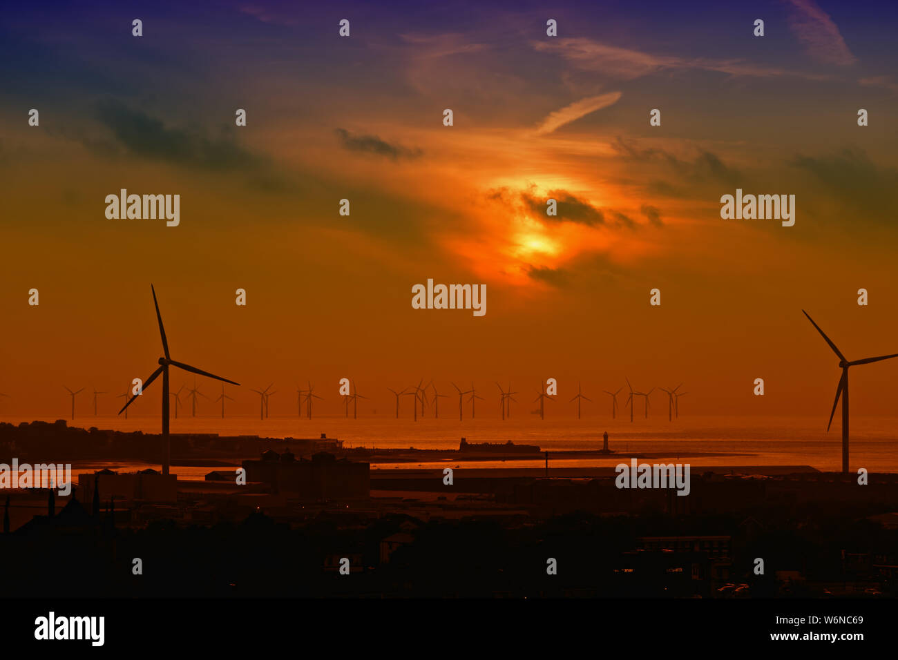 Burbo Bank Offshore Wind Farm turbines Liverpool Bay in silhouette ...