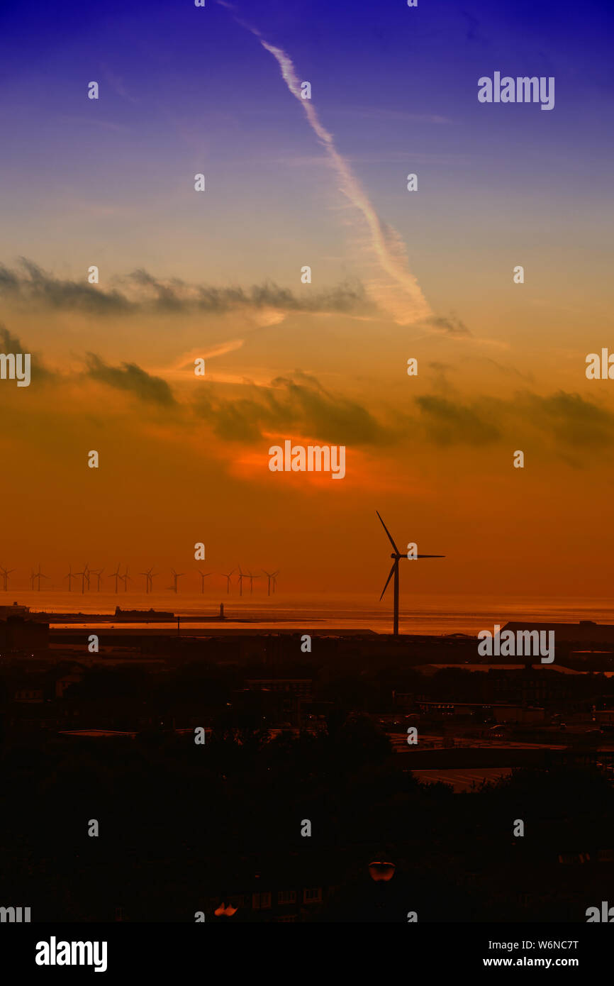 Burbo Bank Offshore Wind Farm turbines Liverpool Bay in silhouette ...