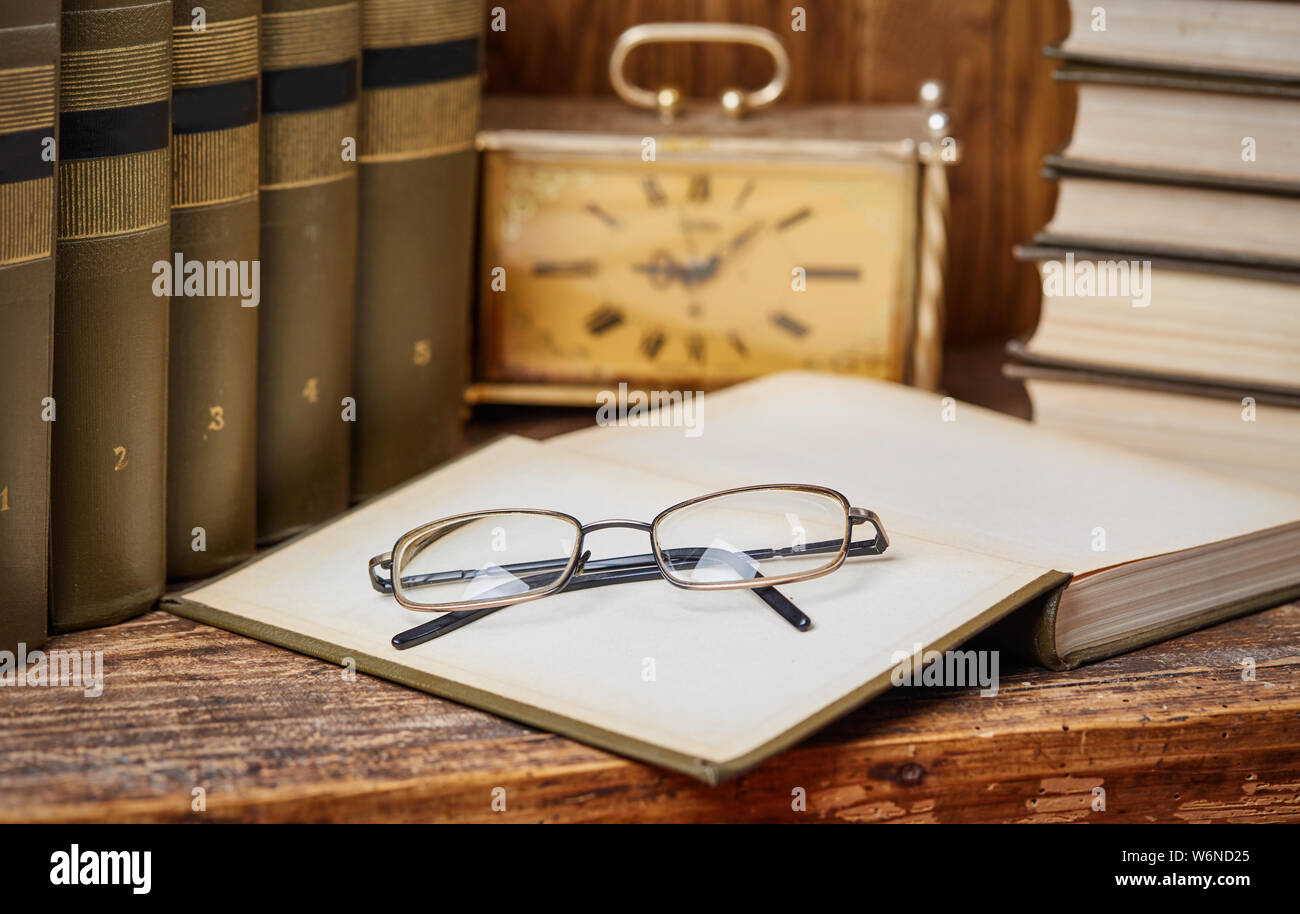 Open books ready for reading on the desk Stock Photo - Alamy