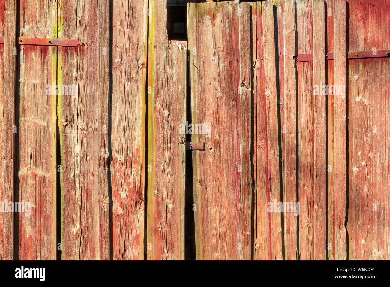 Old red wooden doors of a shed Stock Photo - Alamy