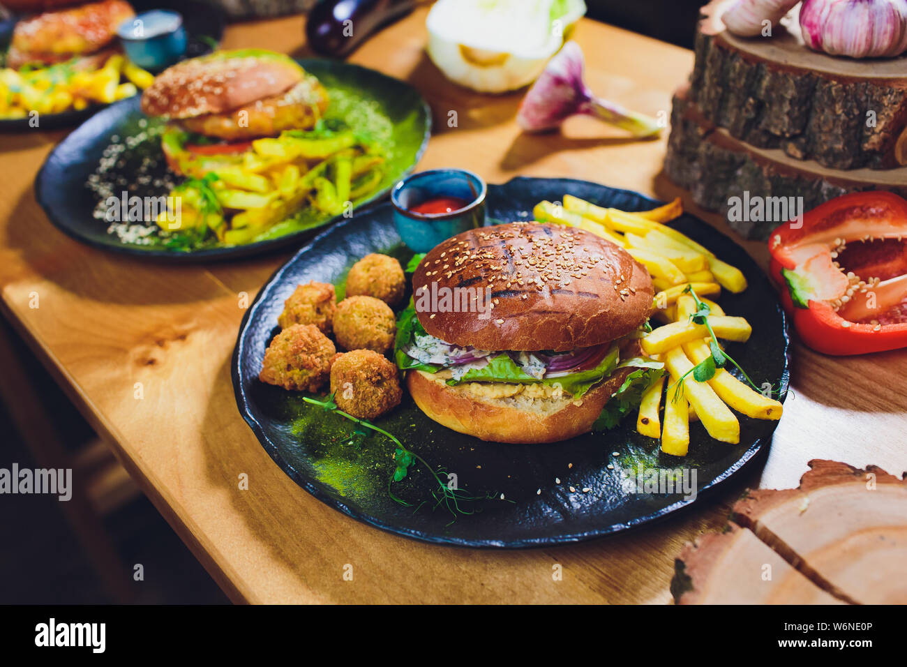 Red, green,black mini burgers with quinoa and vegetables Stock Photo ...