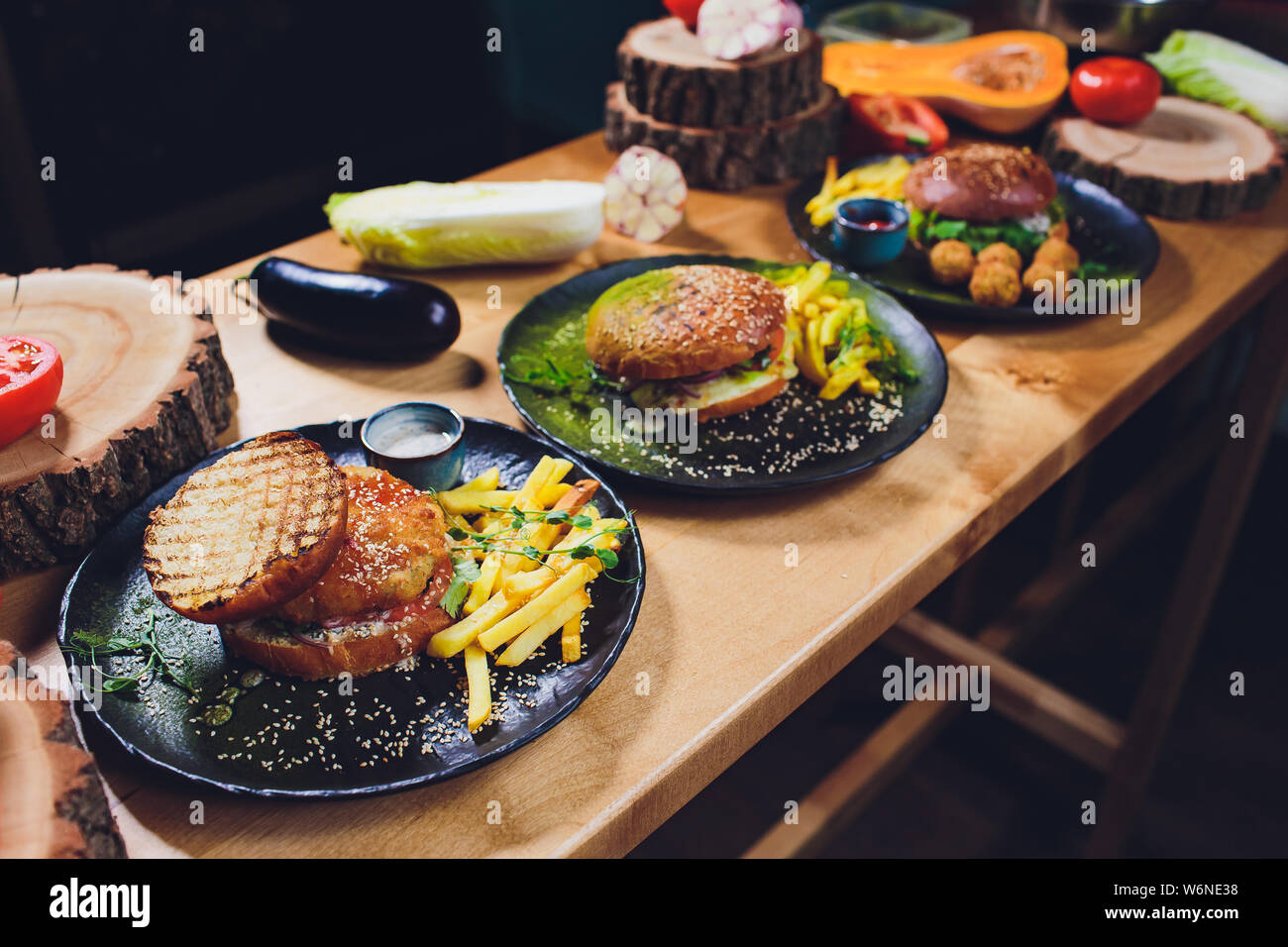 Red, green,black mini burgers with quinoa and vegetables Stock Photo ...