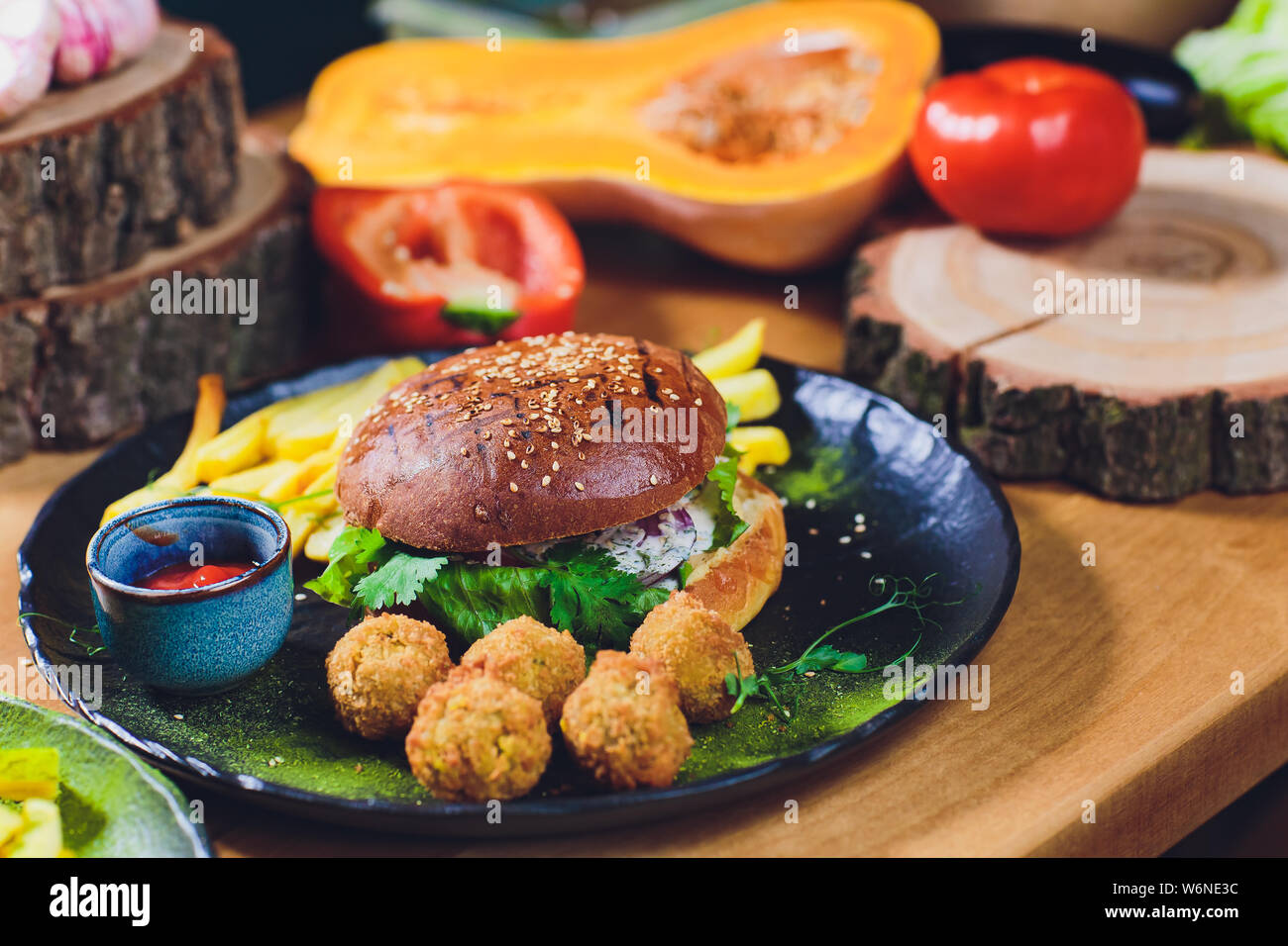 Red, green,black mini burgers with quinoa and vegetables Stock Photo ...