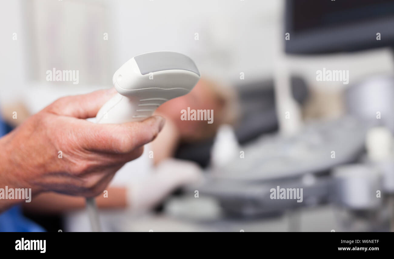 Hand holding tools for ultrasound test in cabinet Stock Photo - Alamy