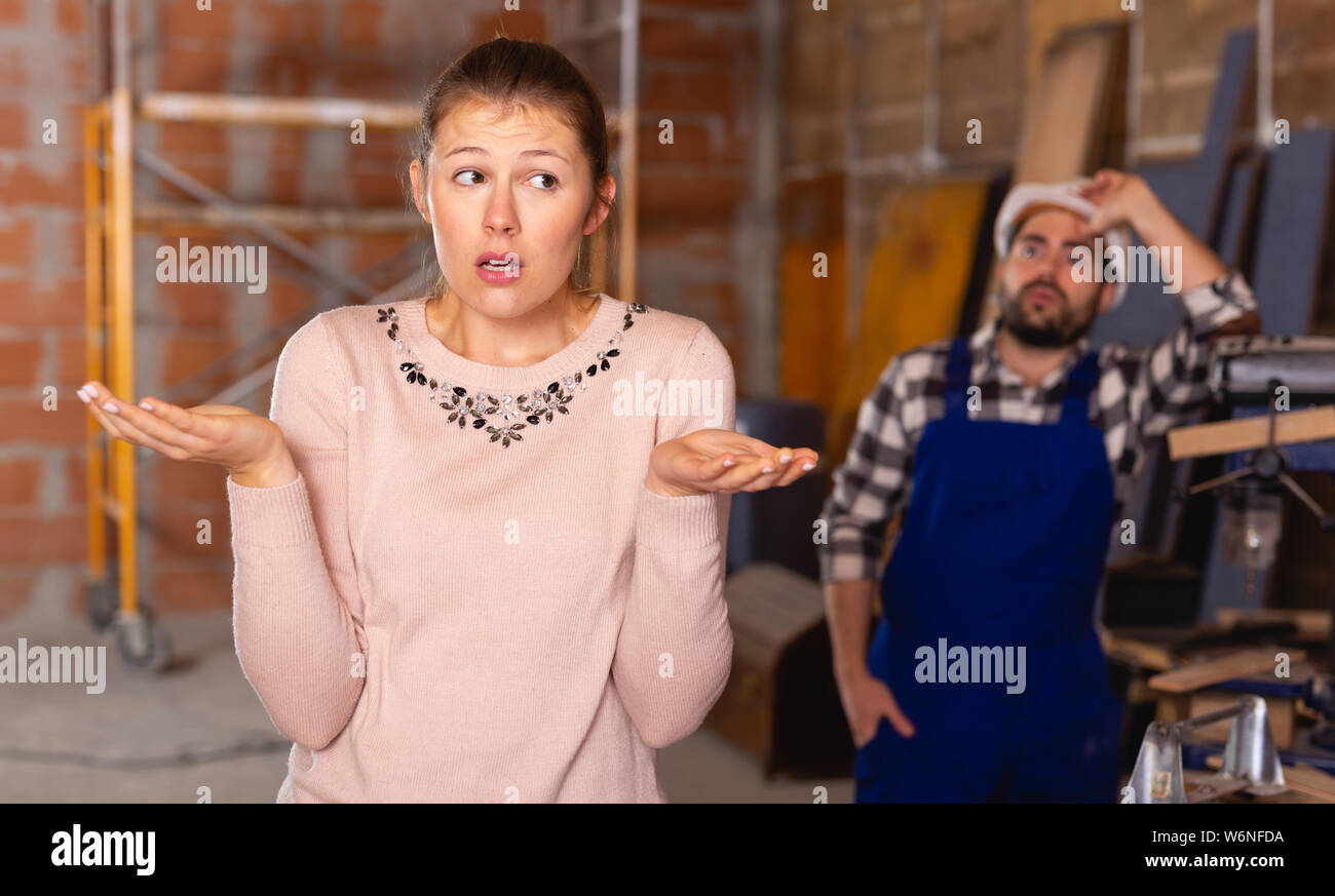 Customer upset with the work of the builder Stock Photo - Alamy