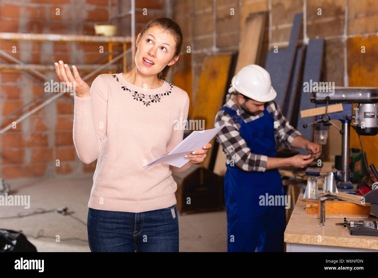 Female designer at construction site Stock Photo - Alamy