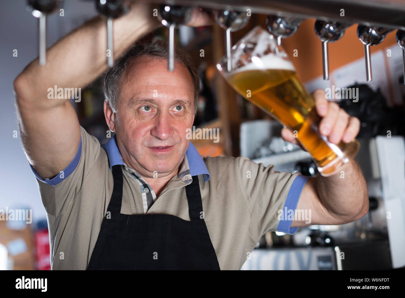 Barman pouring unbottled beer hi-res stock photography and images - Alamy