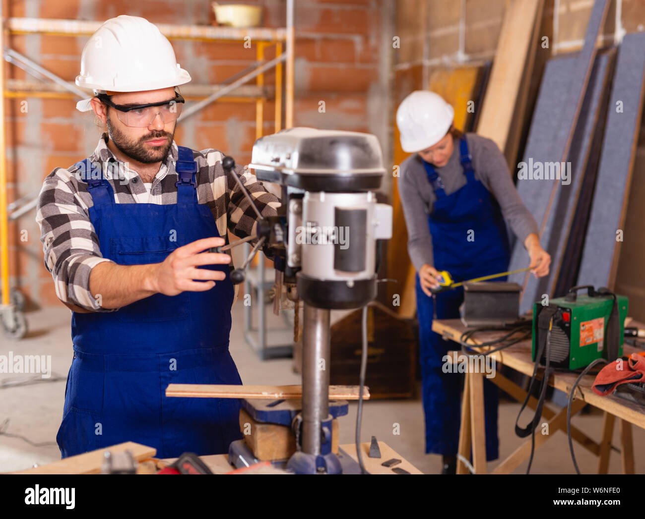 Man worker behind drilling hi-res stock photography and images - Alamy