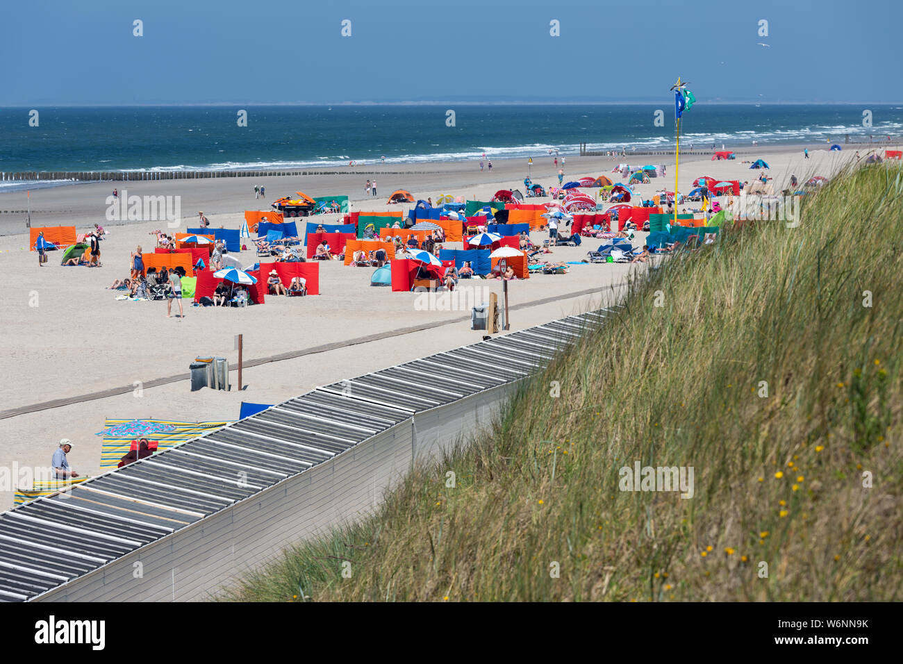 Dutch coast with seaside visitors relaxing at the beach Stock Photo - Alamy