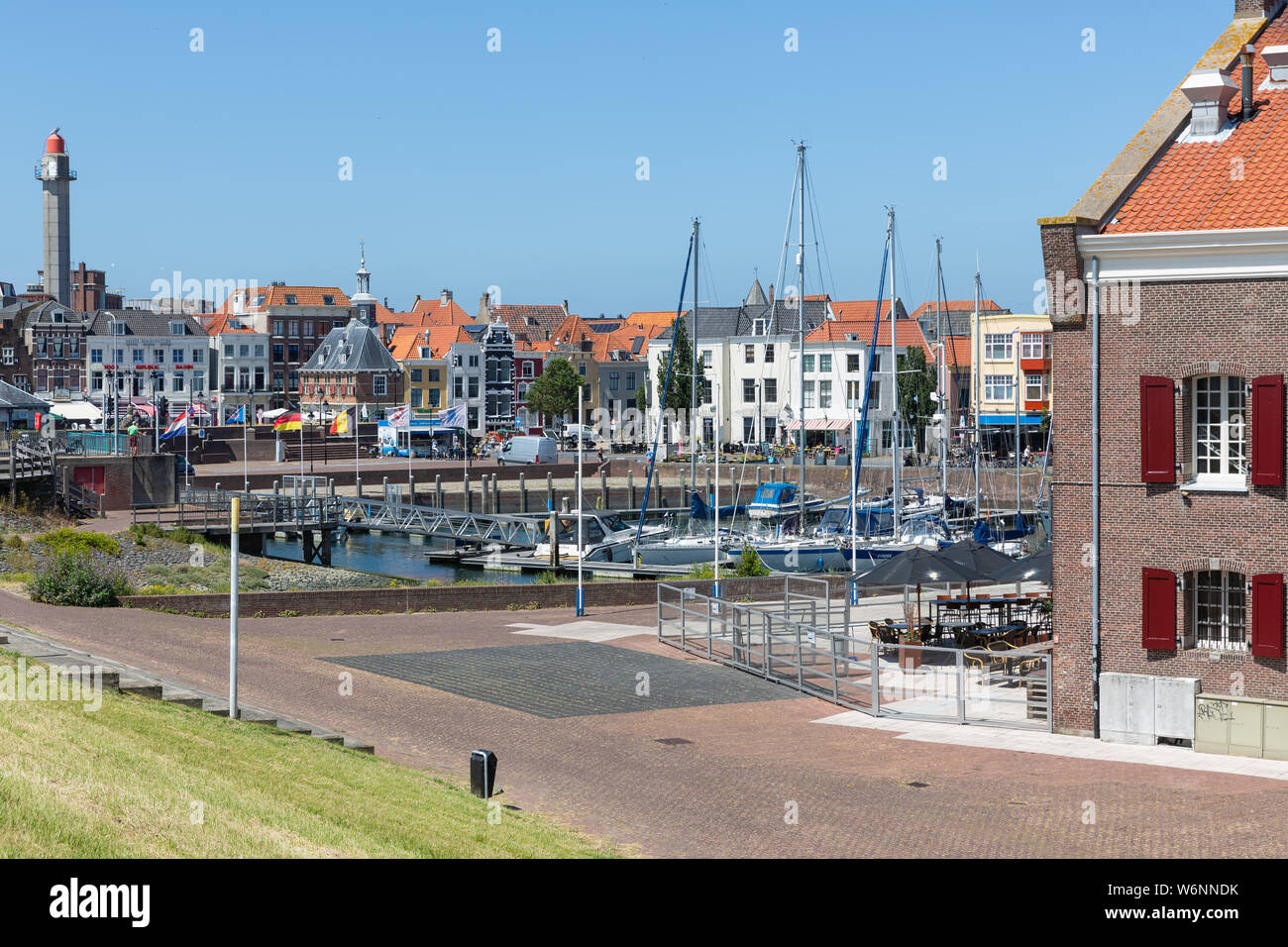 Inner harbor medieval Dutch city Vlissingen with yachts and restaurants ...