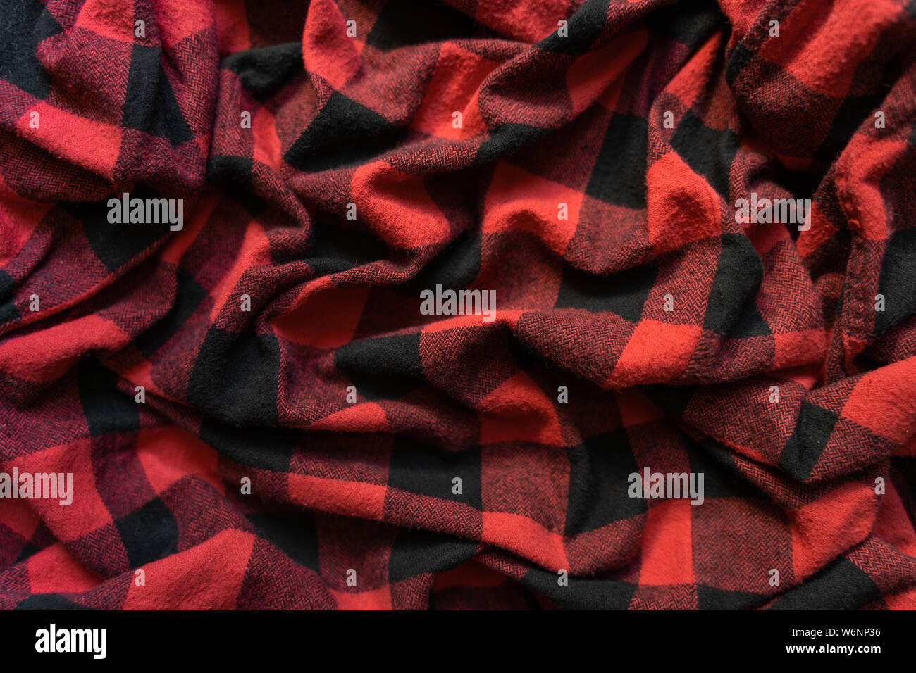 Wrinkled black and red cell clothes background. Fabric with black red ...