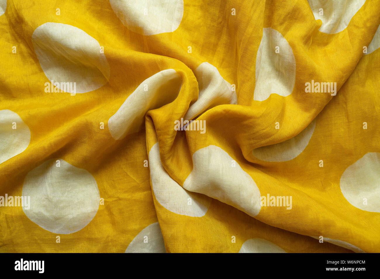 Yellow Synthetic Lining Fabric with Folds. Crumpled Sheet or Clothes ...