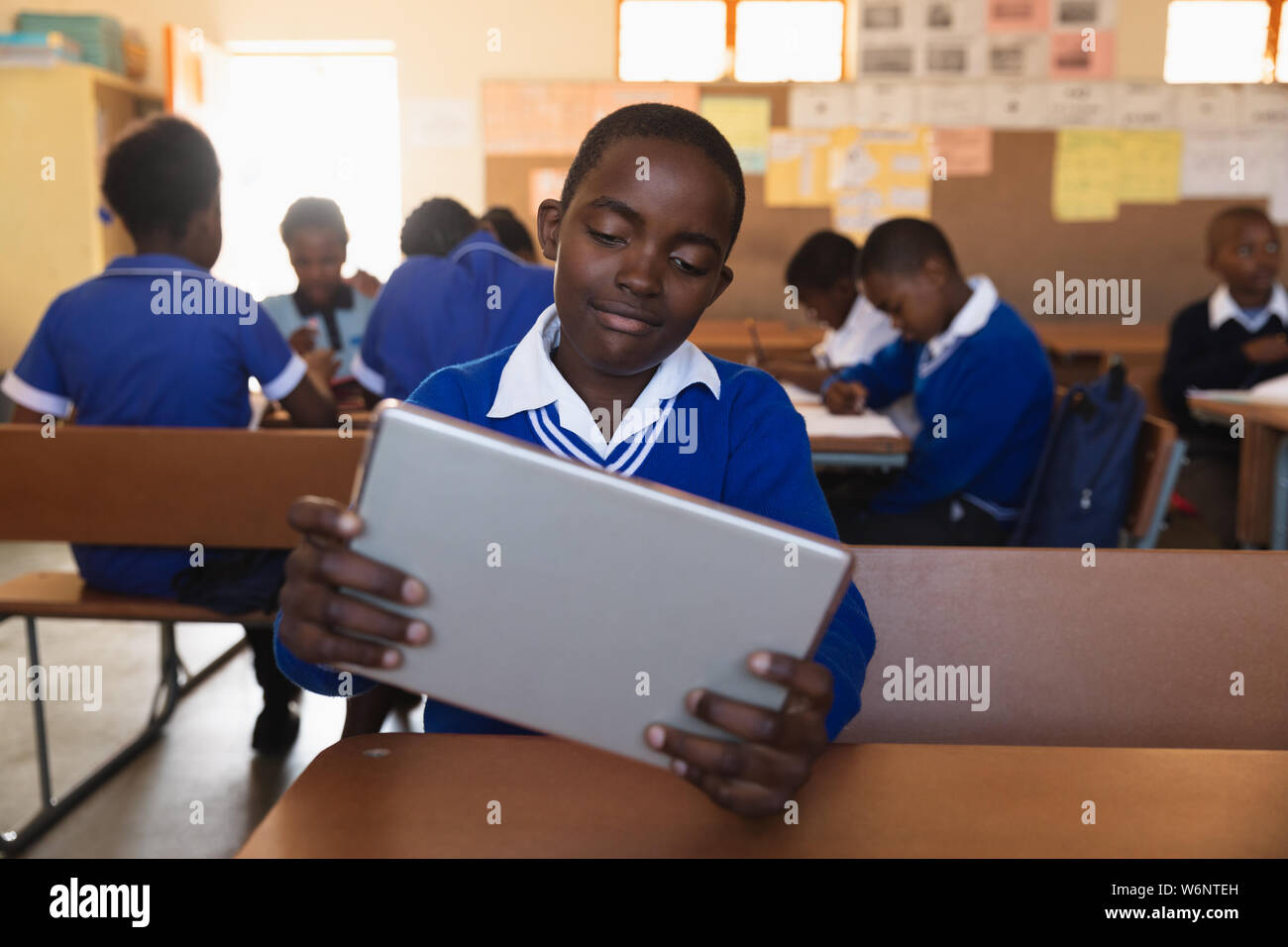 Schoolboy using tablet in a lesson at a township school Stock Photo - Alamy