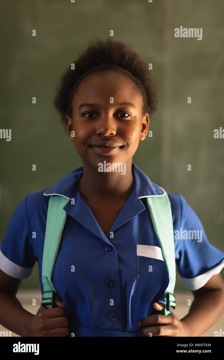 Portrait of a smiling elementary school girl Stock Photo - Alamy