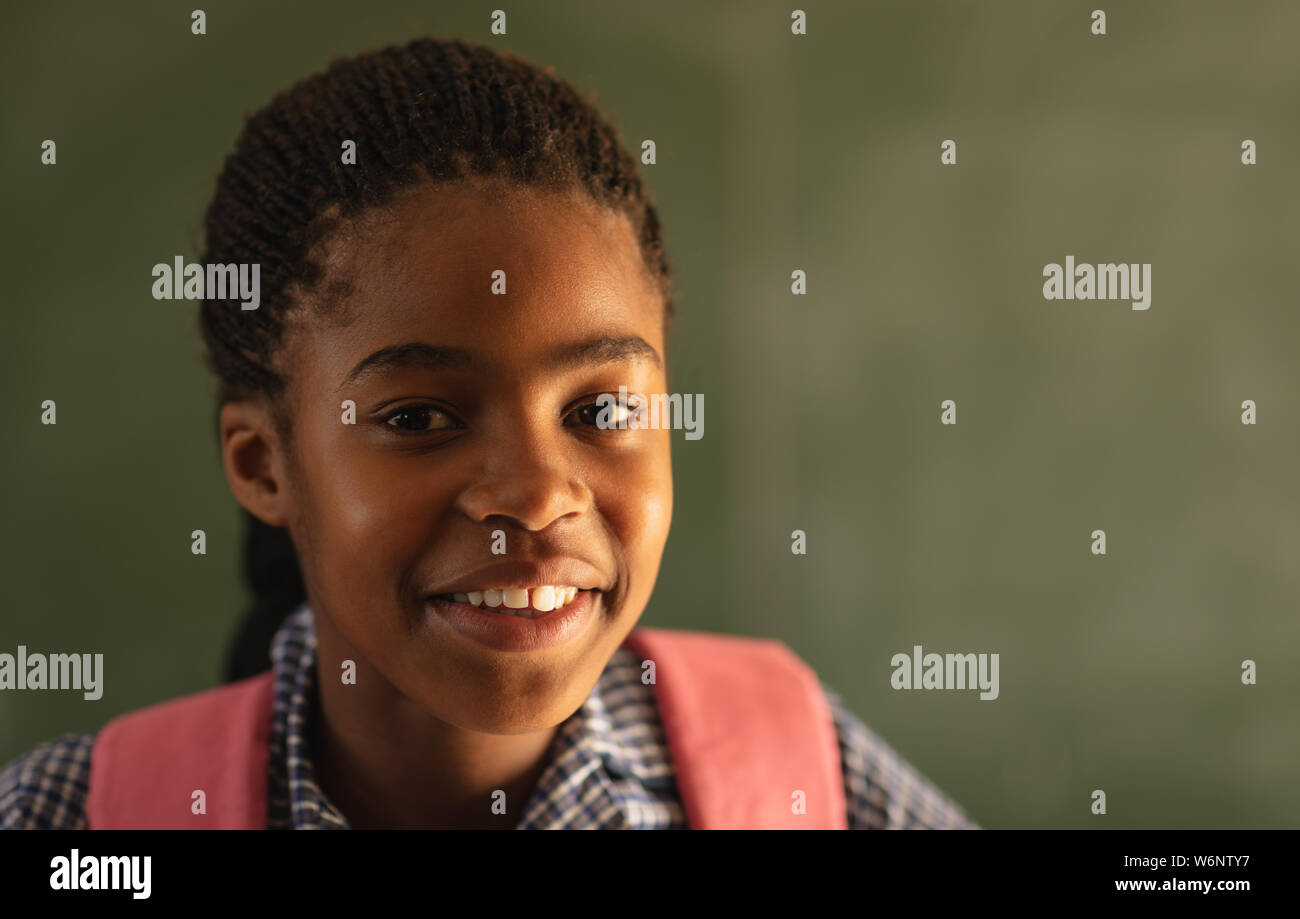 Portrait of a smiling elementary school girl Stock Photo - Alamy