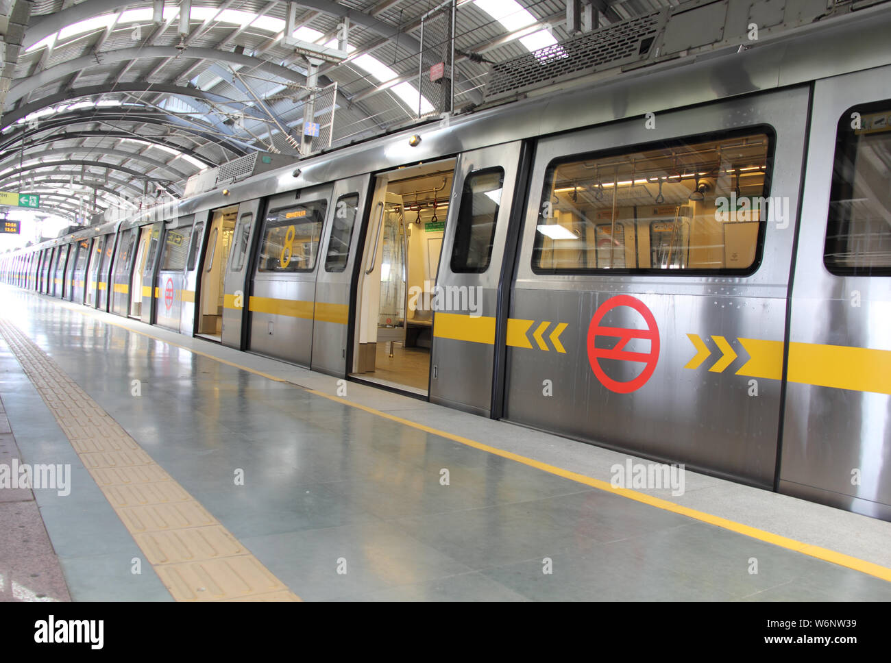 Metro train at a platform Stock Photo - Alamy