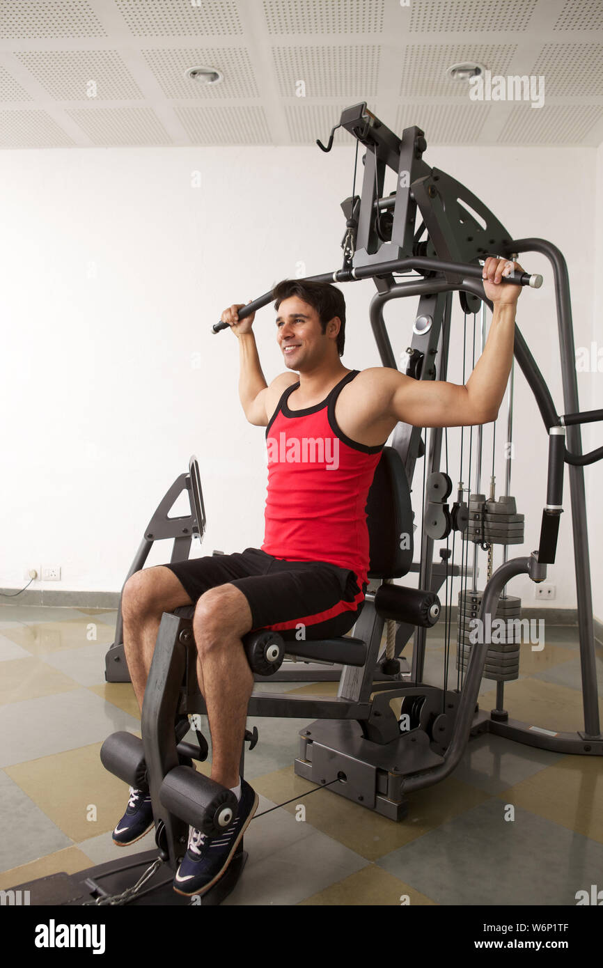 Man Weightlifting in a gym Stock Photo - Alamy