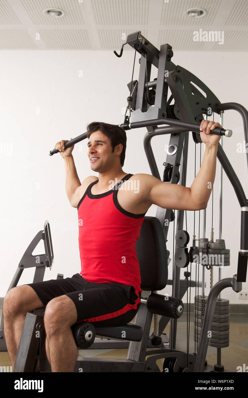 Man Weightlifting in a gym Stock Photo - Alamy