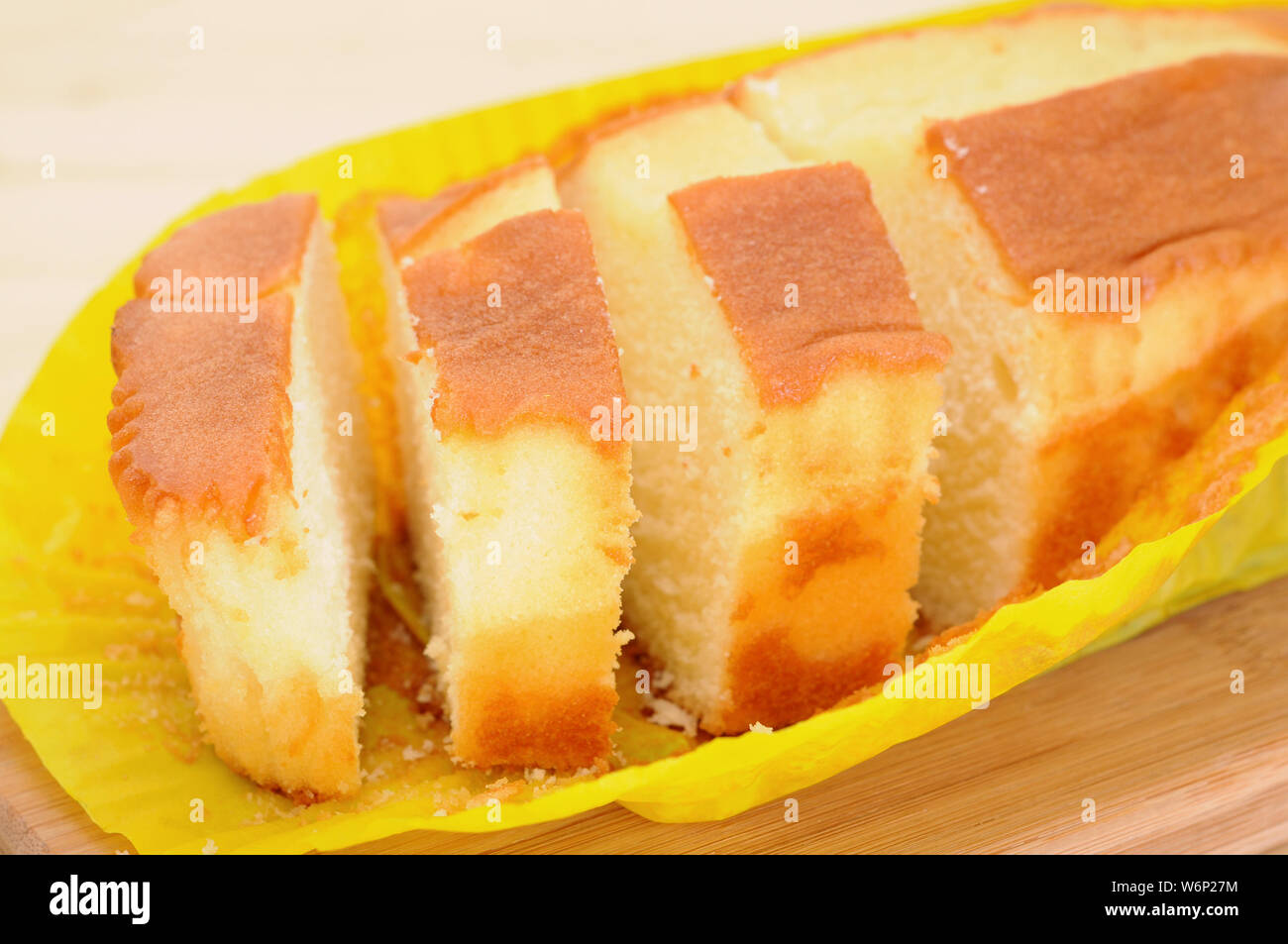 butter cake and slice display at market place Stock Photo - Alamy