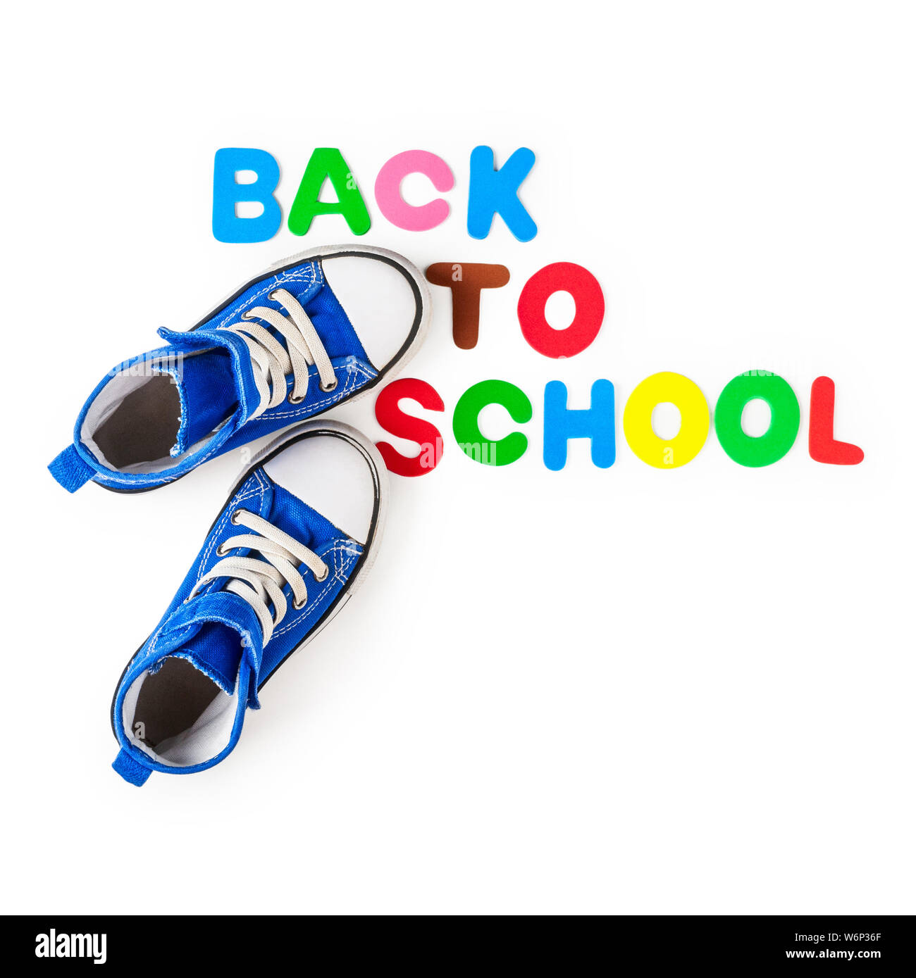Back to school concept with blue sneakers. Children sport casual shoes ...