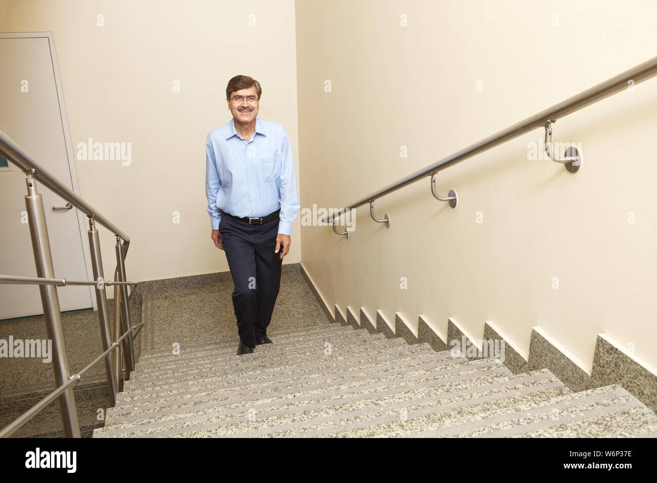 Old man up ladder hi-res stock photography and images - Alamy