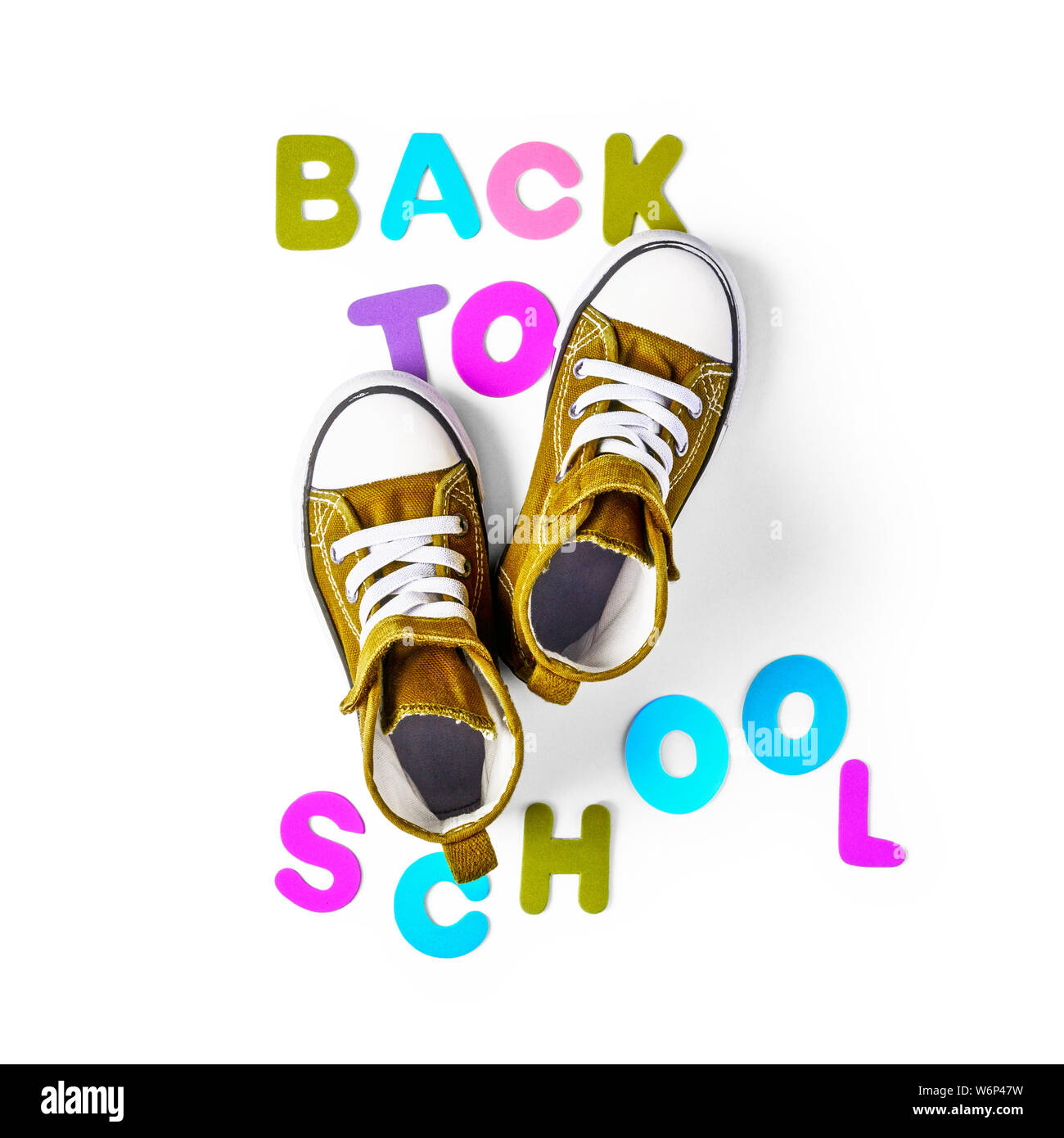 Back to school concept with old sneakers. Children sport shoes and ...