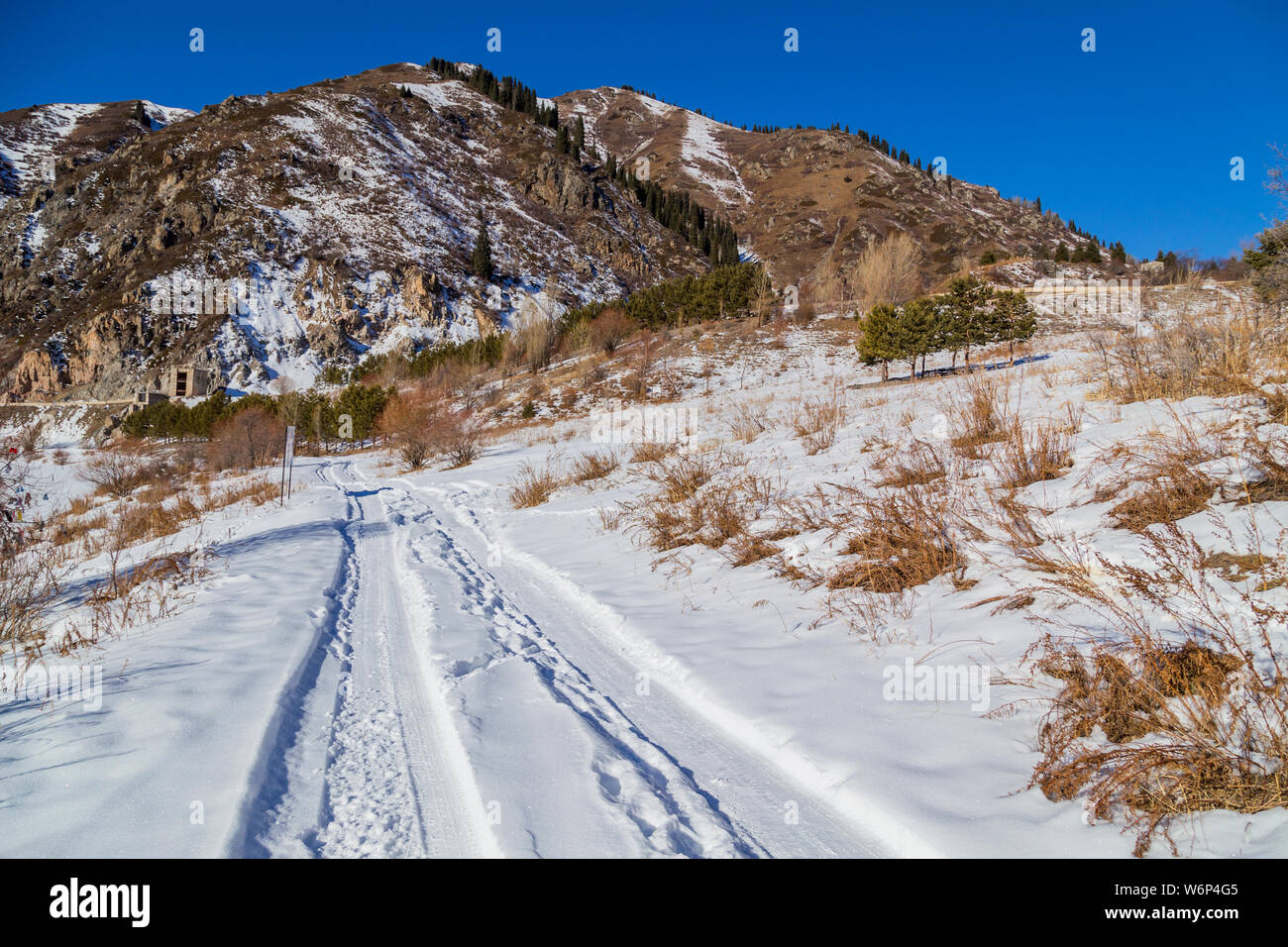 Winter Snowy Mountains valley with sun in Ak Bulak, Almaty, Kazakhstan ...
