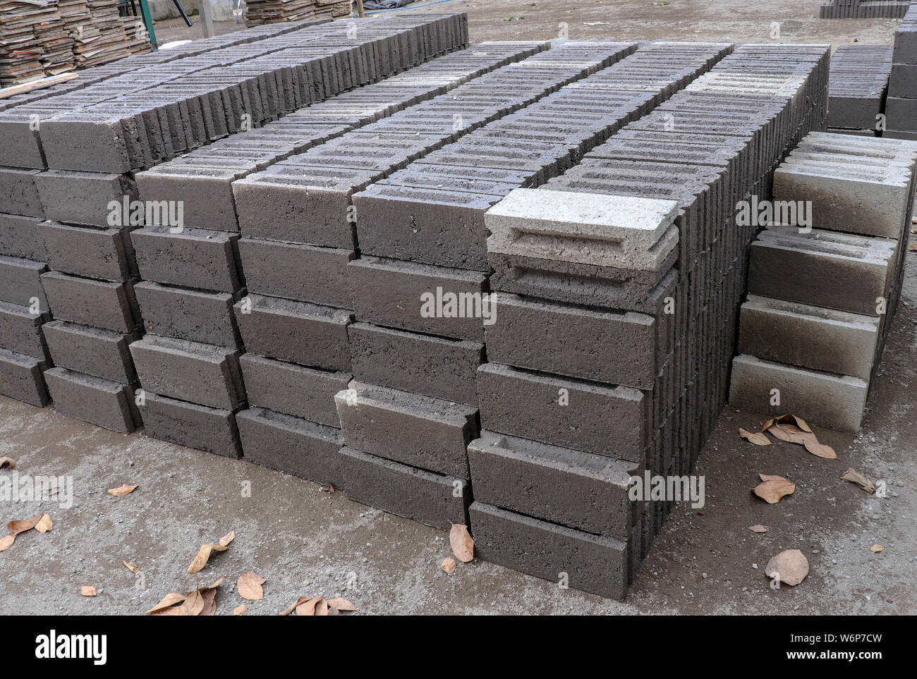 Handmade bricks made of black volcanic sand, water and cement. Manual ...