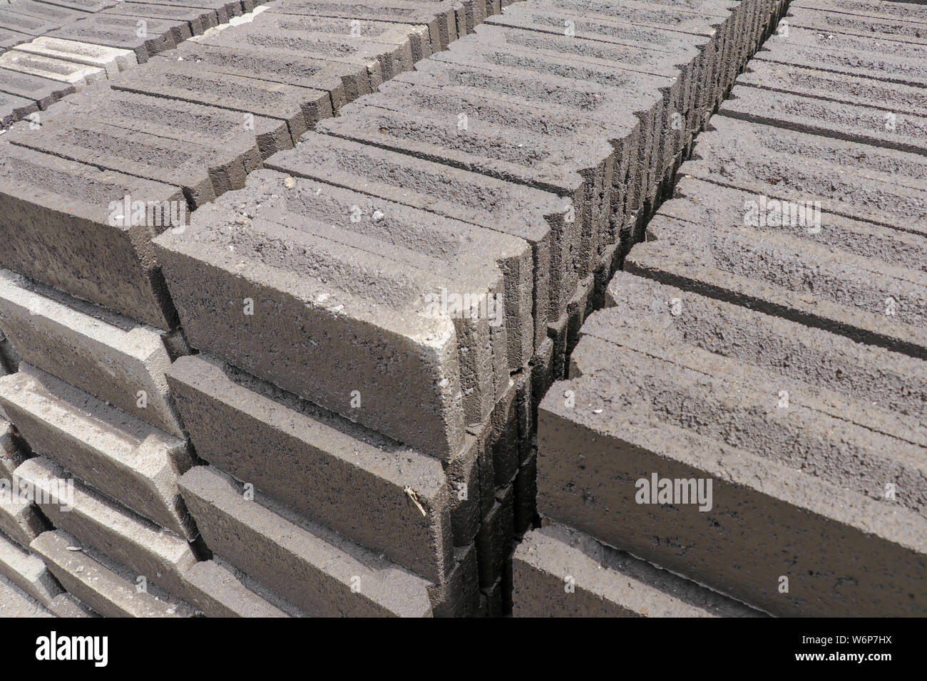 Handmade bricks made of black volcanic sand, water and cement. Manual ...