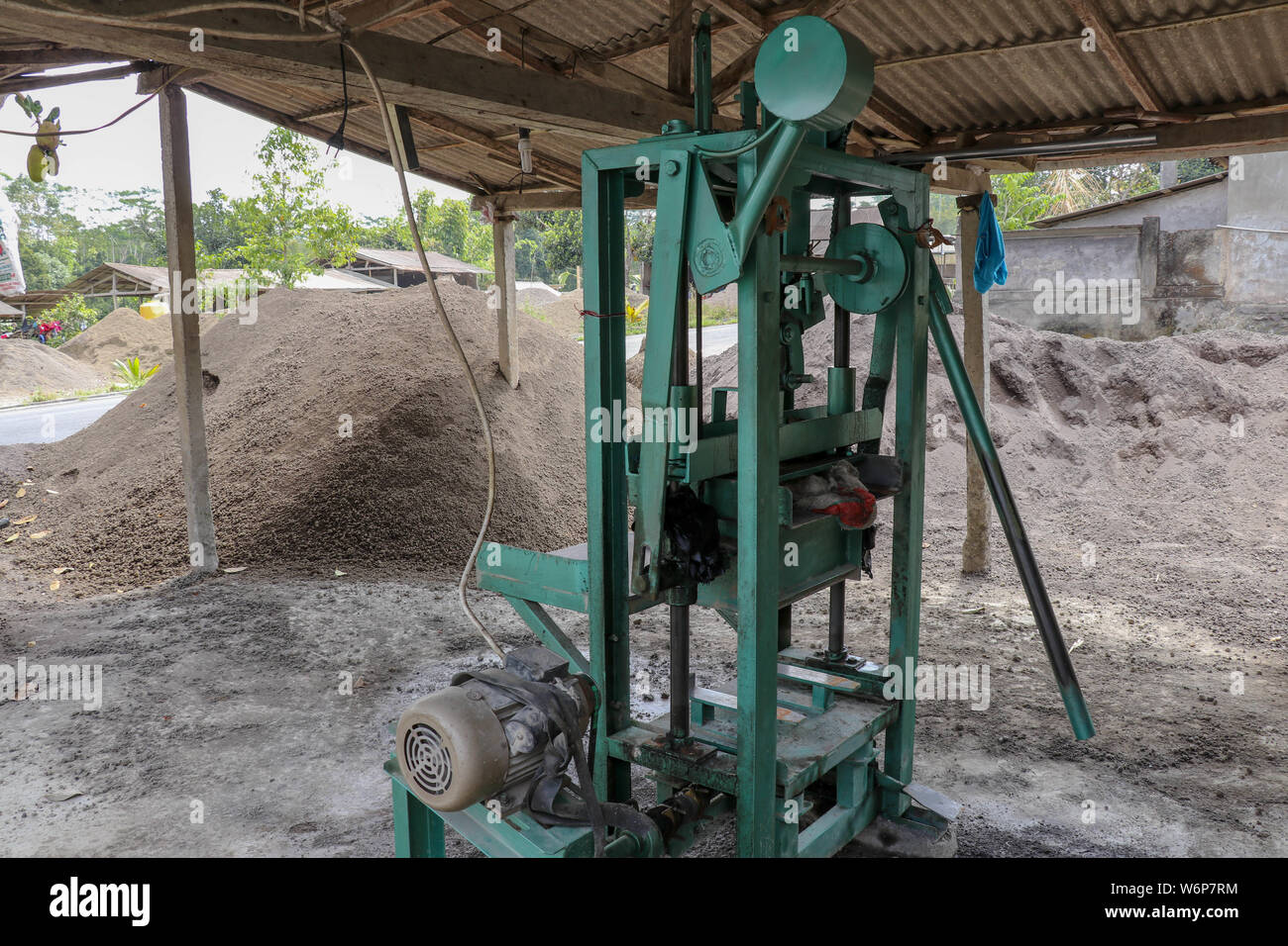 Green steel hand press with electric motor to produce bricks in Bali ...