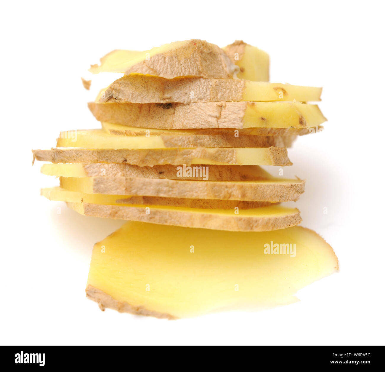 closeup a stack of sliced ginger on white Stock Photo - Alamy