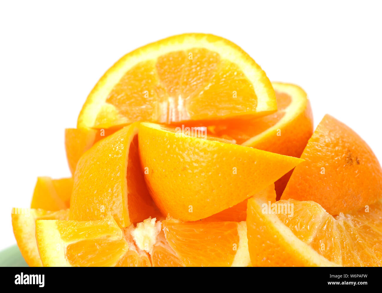 a group of chopped orange fruit isolated on white Stock Photo - Alamy