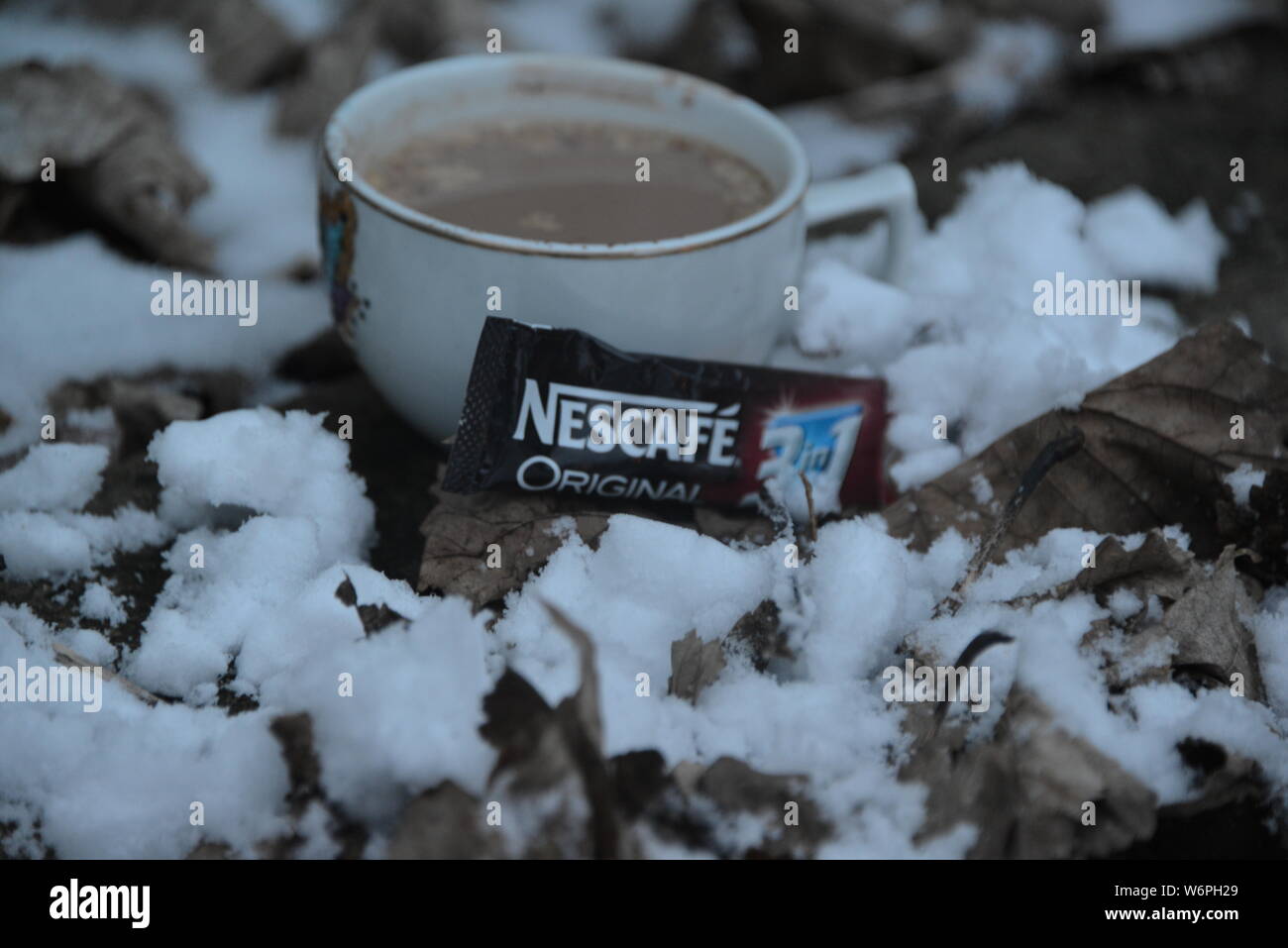 cup of Nescafe in winter chilling with snow cup of coffee and cake ...
