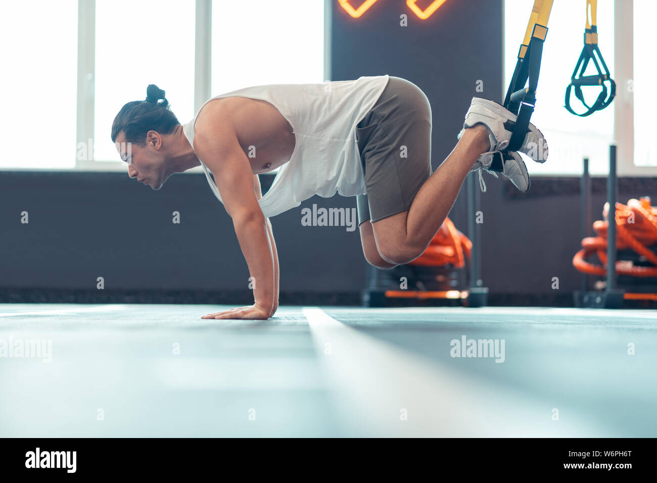 Serious hard working man training in the gym Stock Photo - Alamy