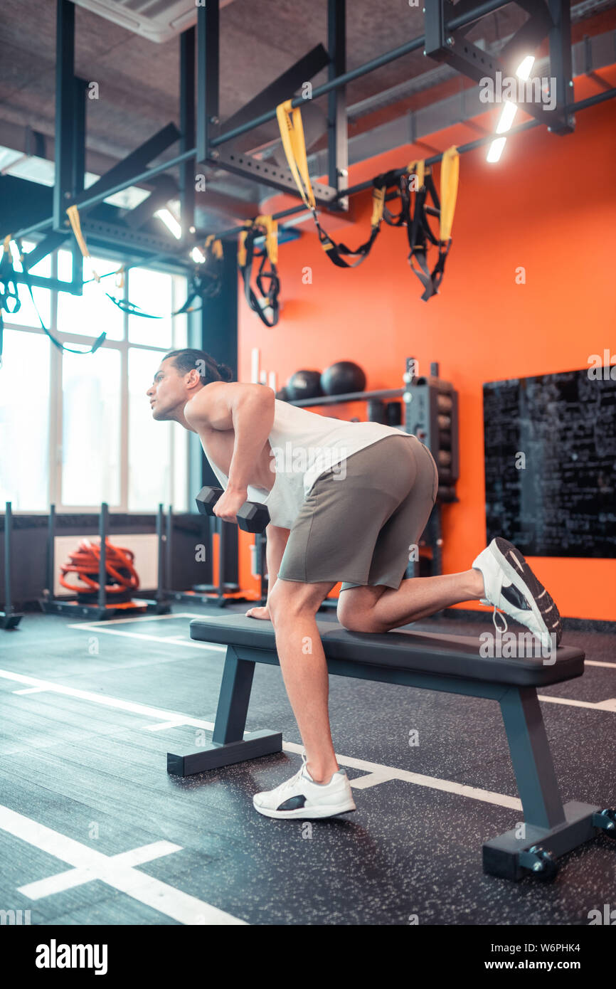 Nice fit man wanting to develop his strength Stock Photo - Alamy