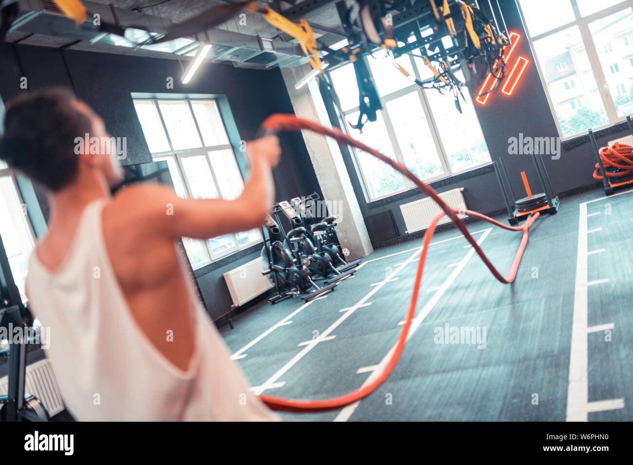 Athlete training with battling ropes hi-res stock photography and ...