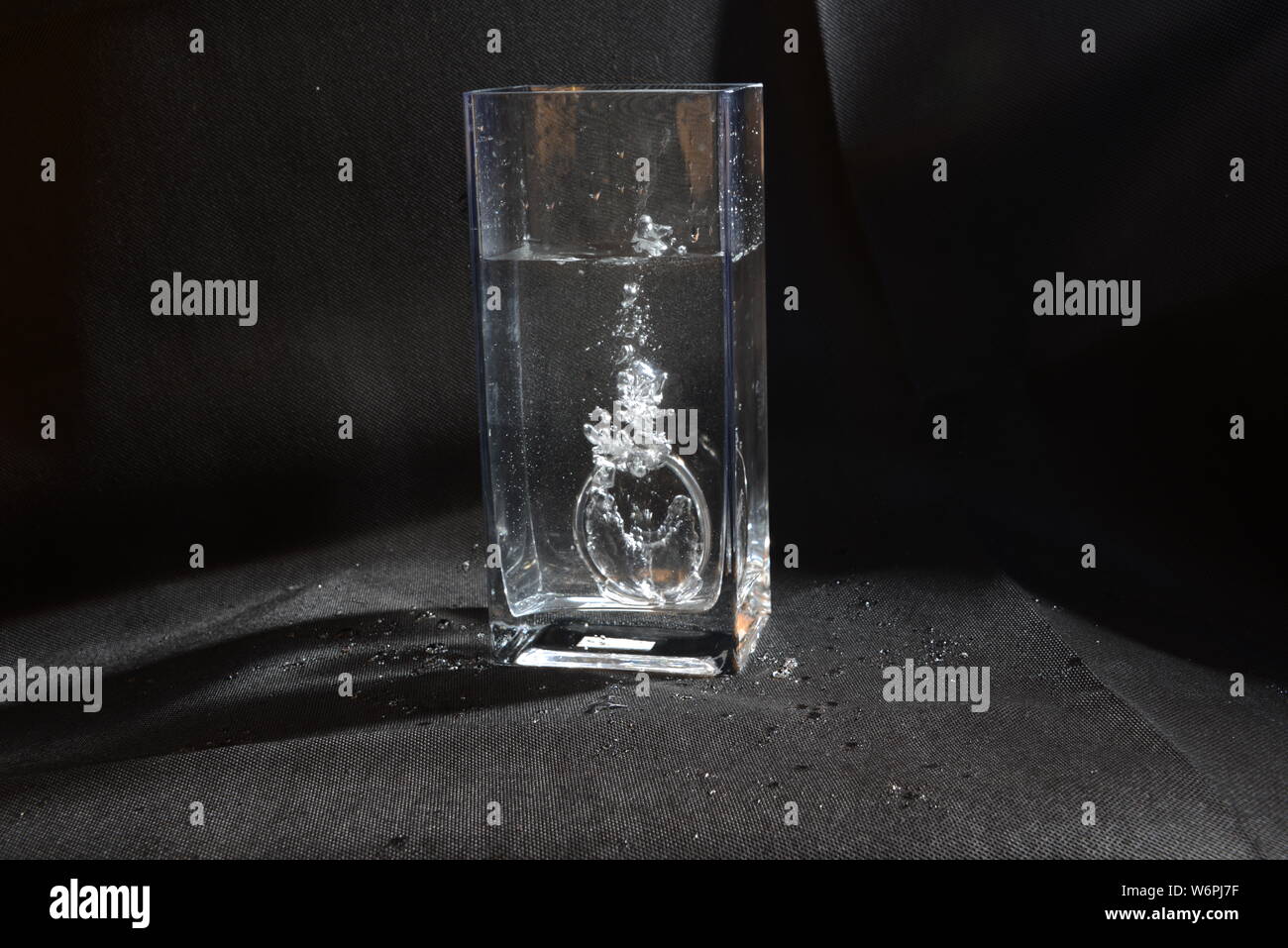 professional photo of accessories drop in to water the moment of ...