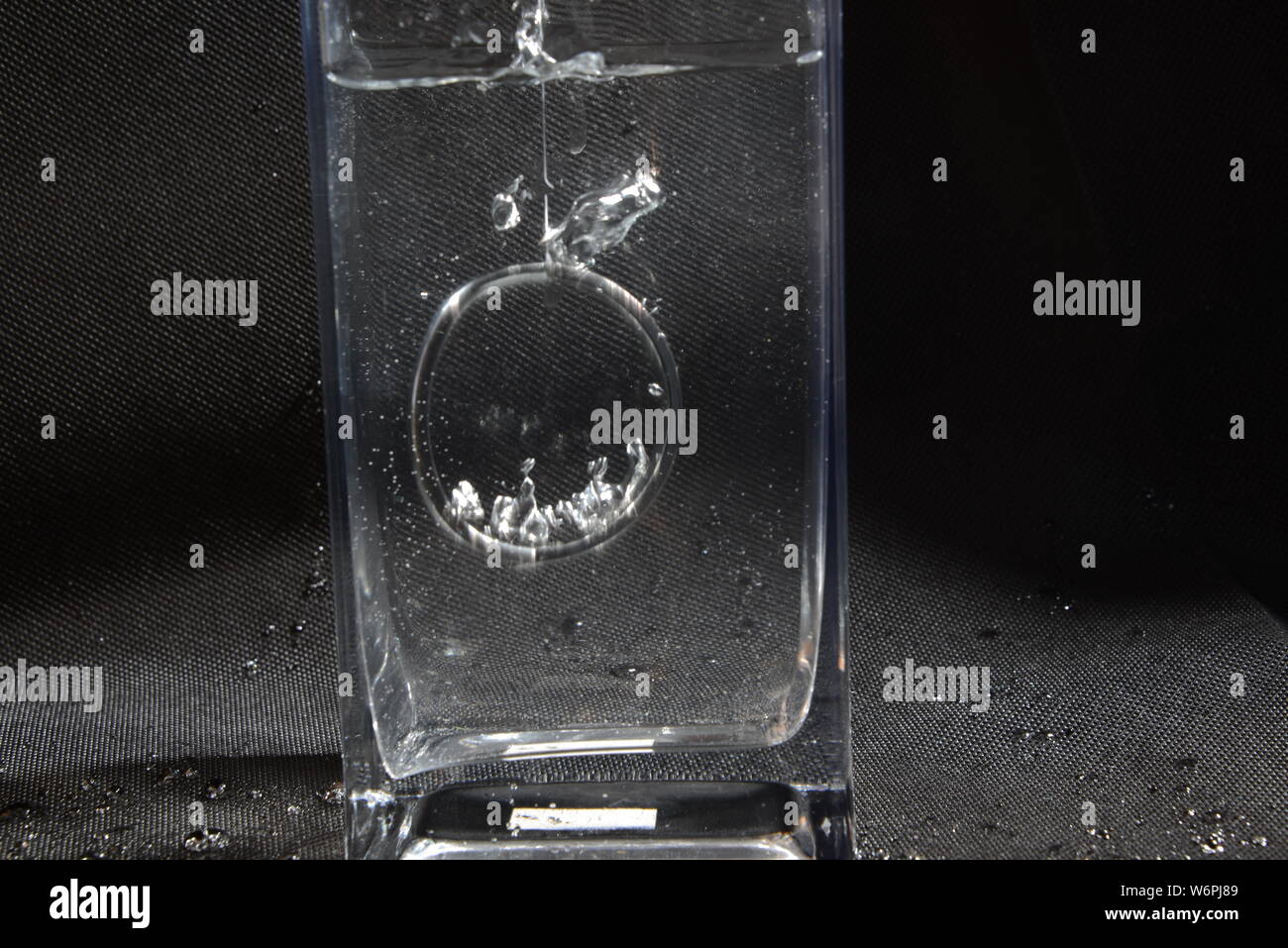 professional photo of accessories drop in to water the moment of ...