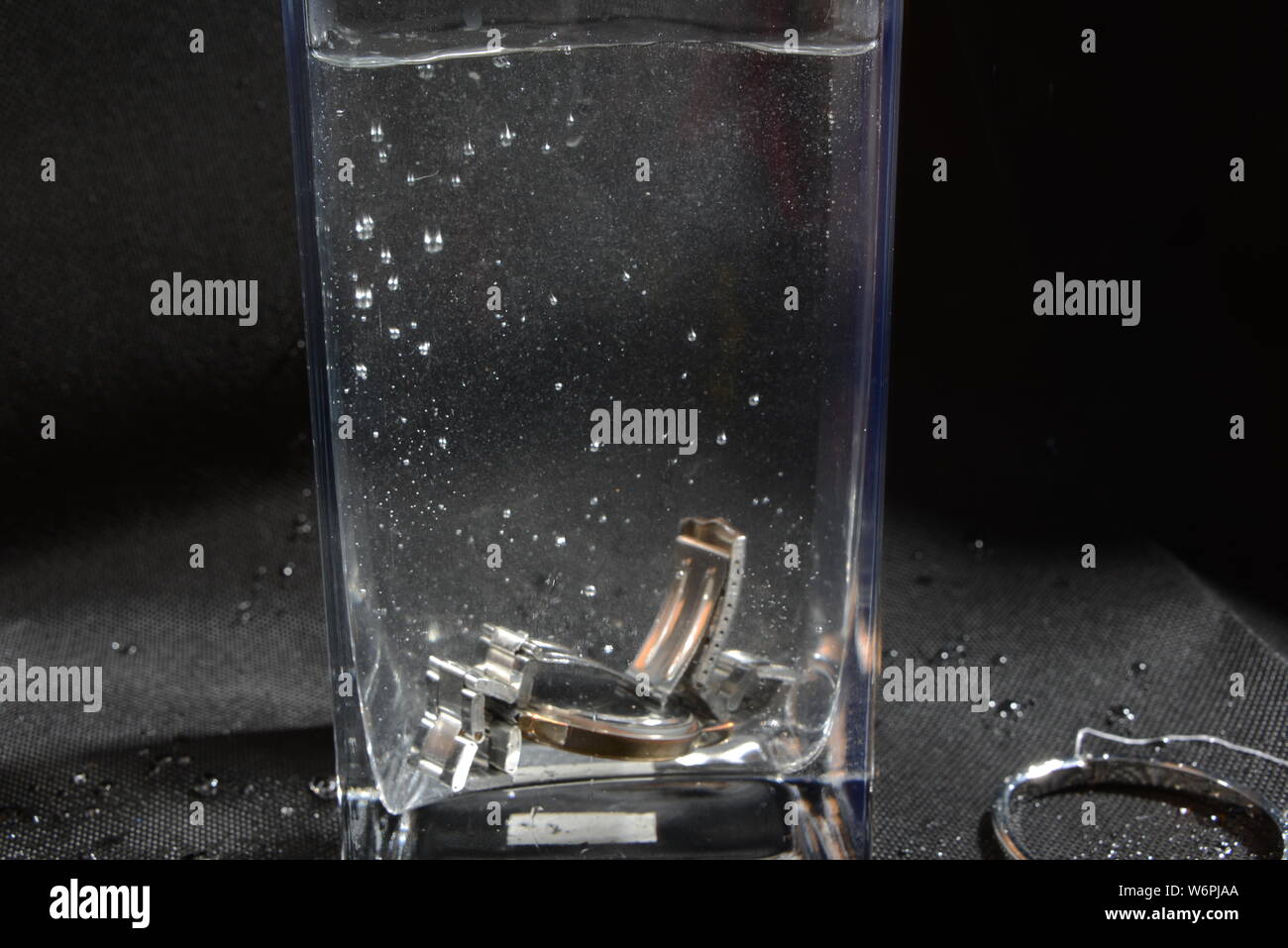 professional photo of accessories drop in to water the moment of ...