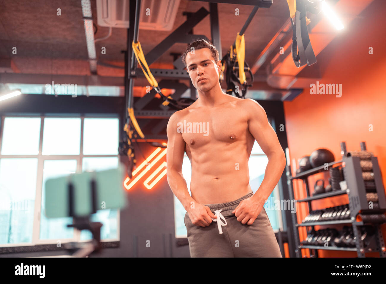 Handsome attractive sportsman having his own blog Stock Photo - Alamy