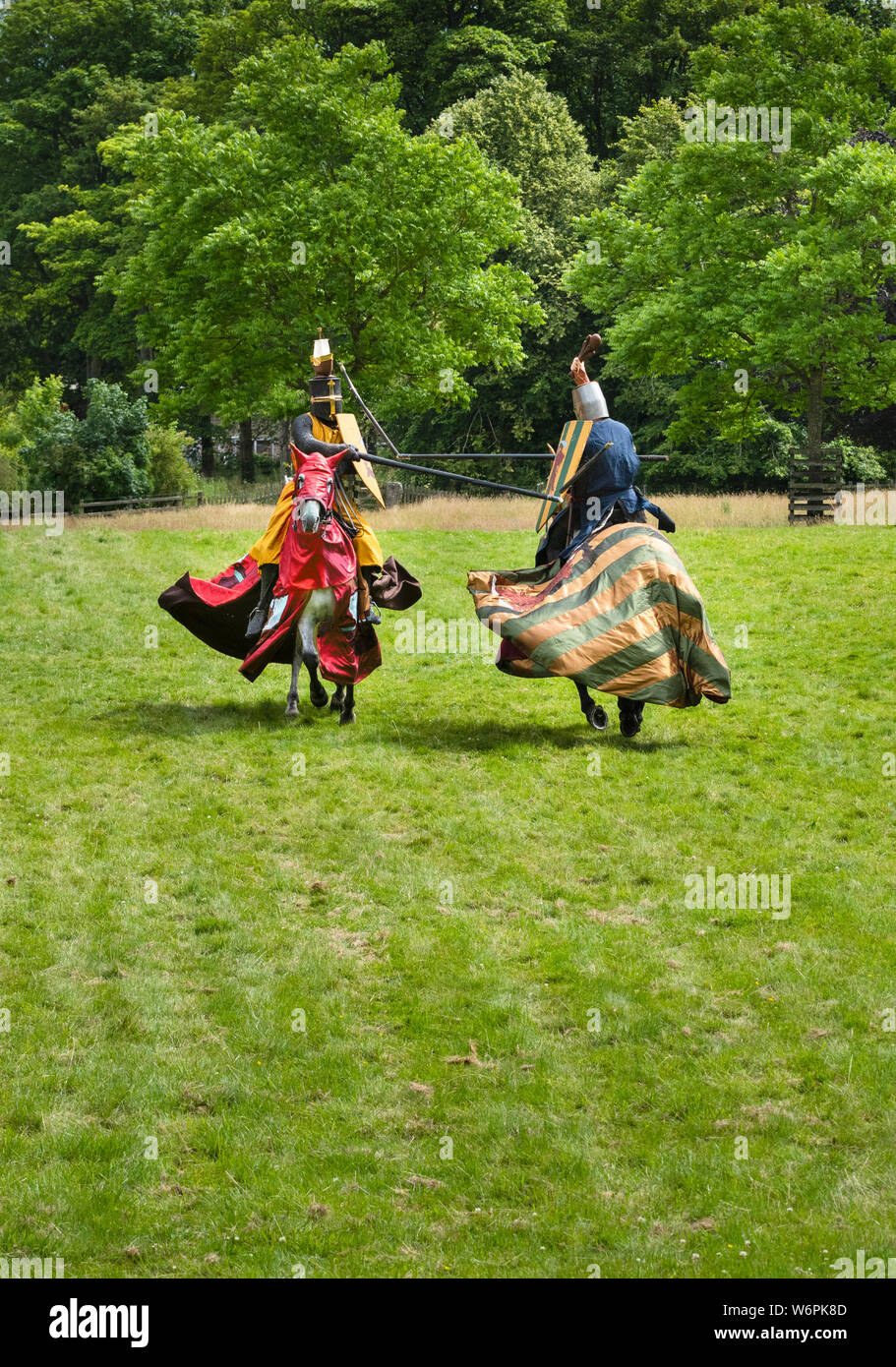 Mounted knights in medieval armour fighting on horseback during ...