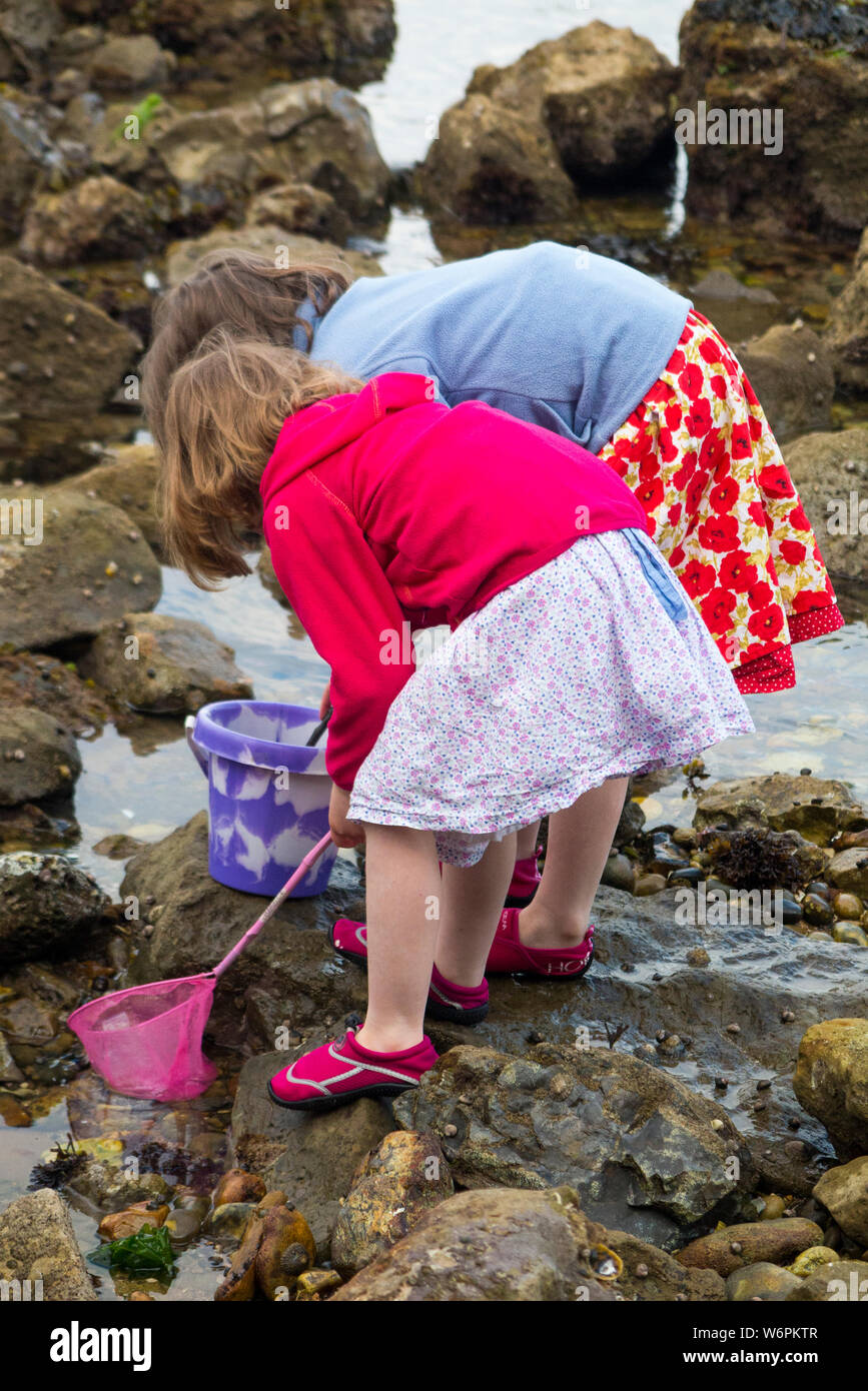 Kids fishing nets on beach hi-res stock photography and images - Alamy