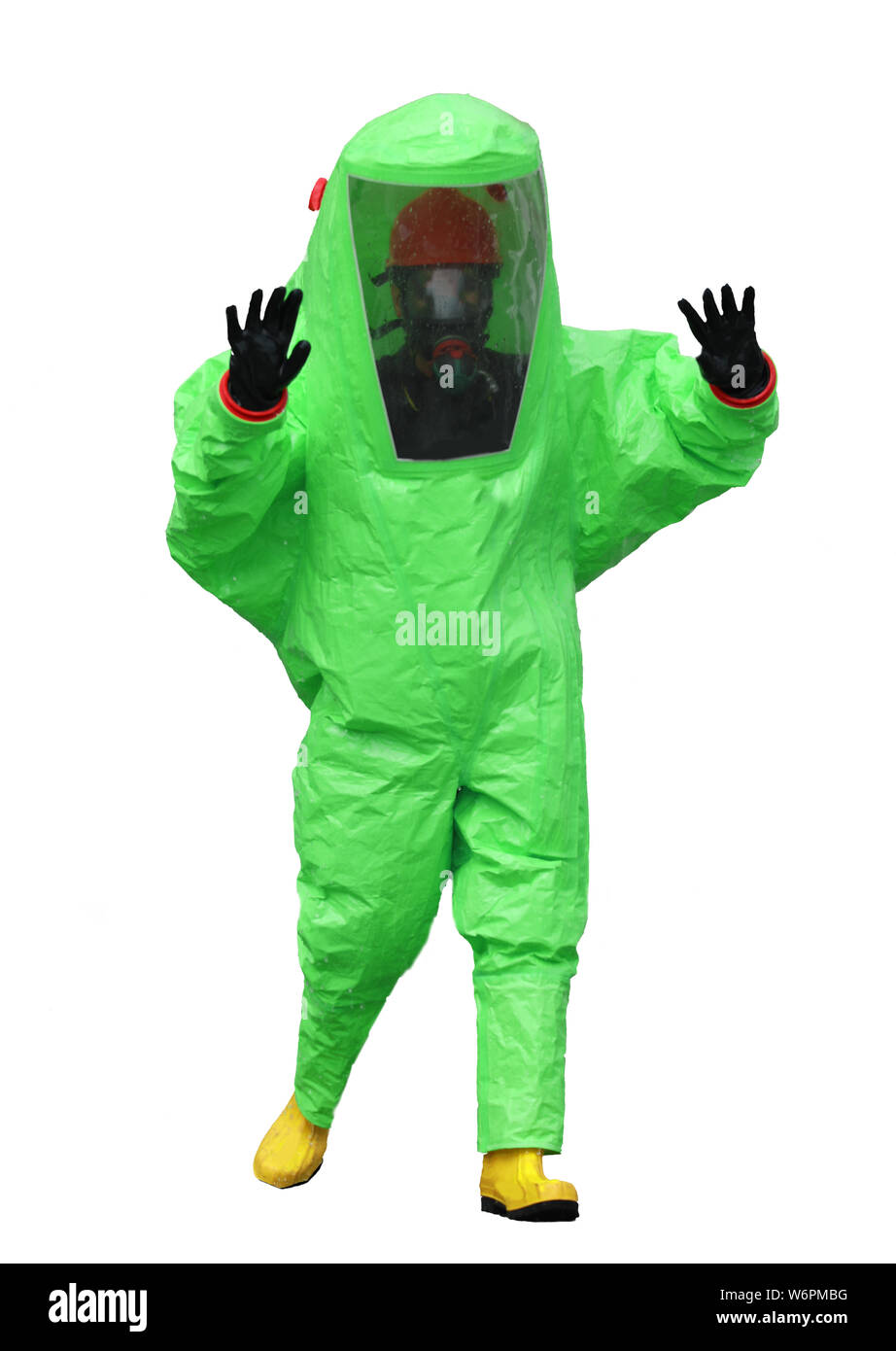 fireman wears a special phosphorescent coverall to extinguish a fire ...