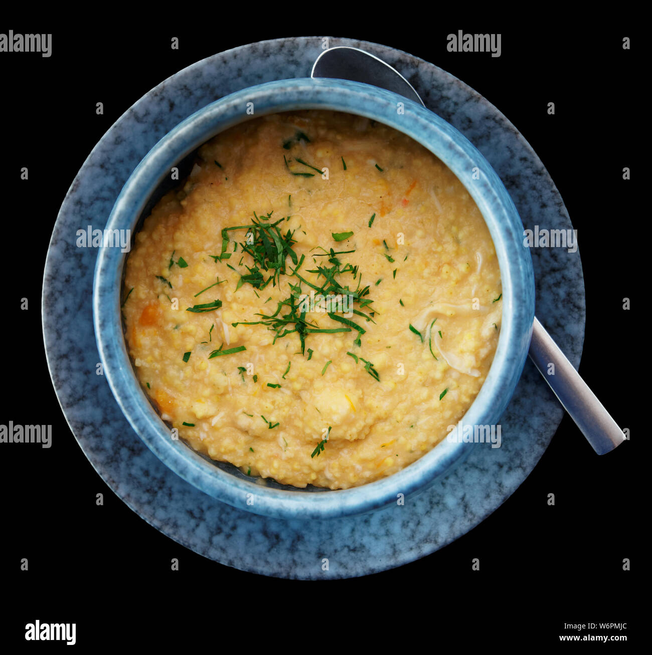 Millet cereal in stoneware bowl shot from above, Russian cuisine dish ...
