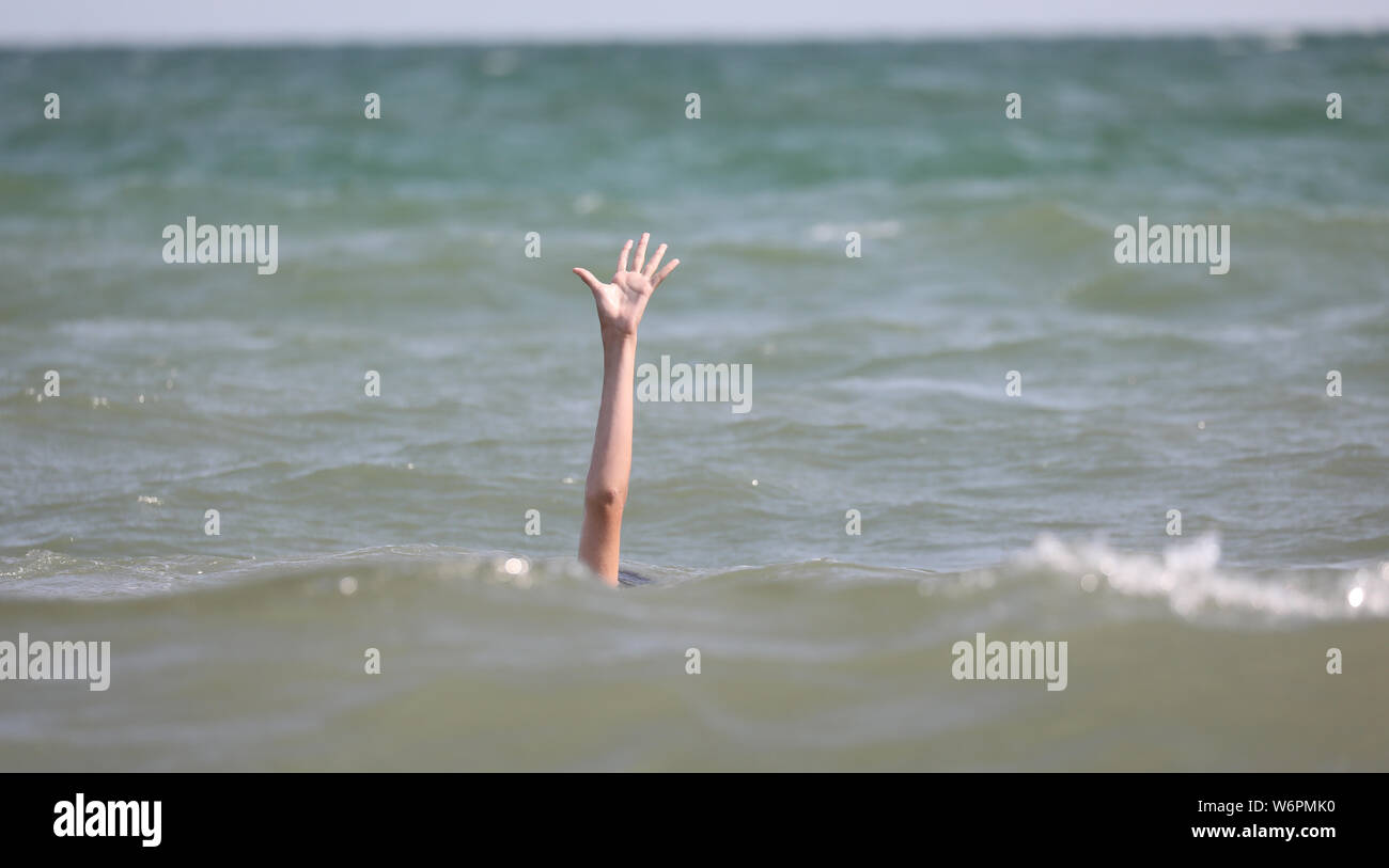 alone hand on the water of the ocean Stock Photo - Alamy